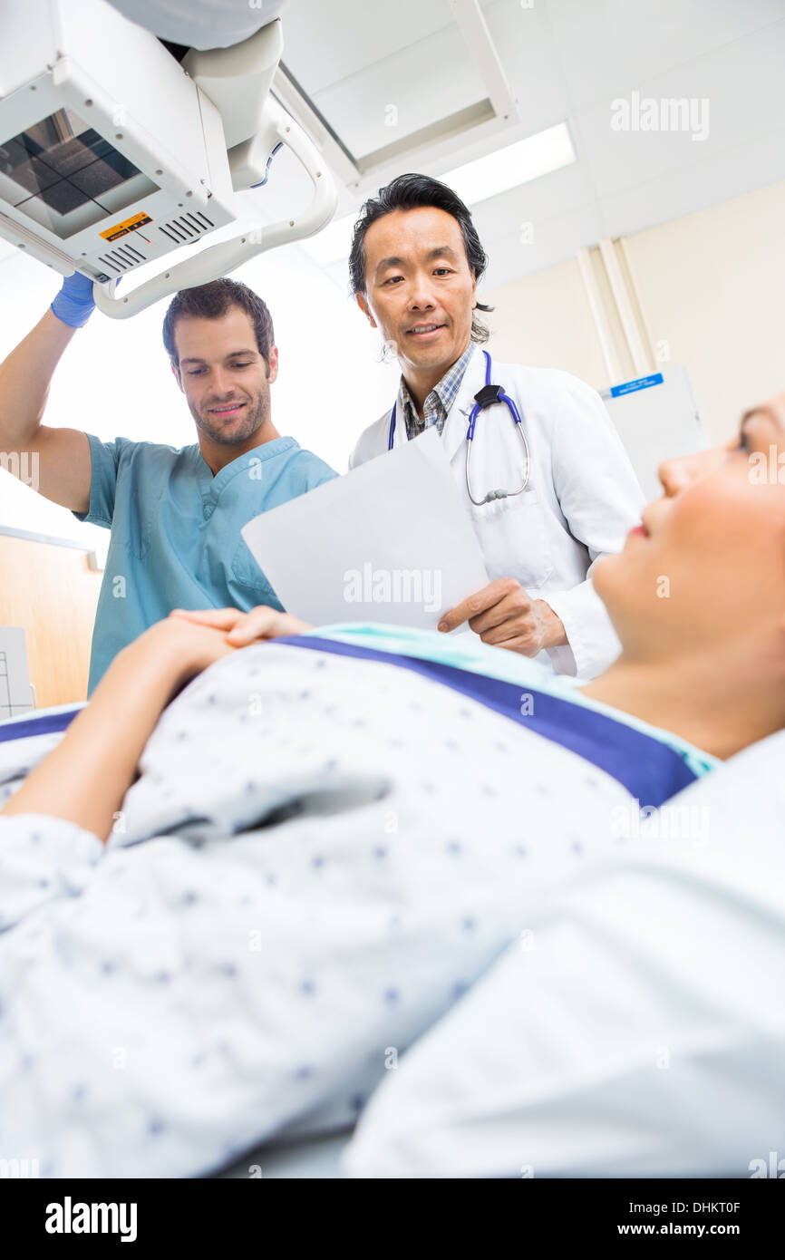 Medical Team Preparing Patient In Xray Room Stock Photo - Alamy