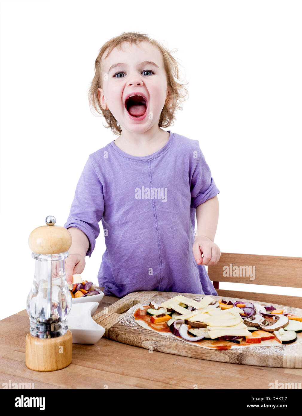 screaming child making fresh pizza. studio shot isolated in white ...