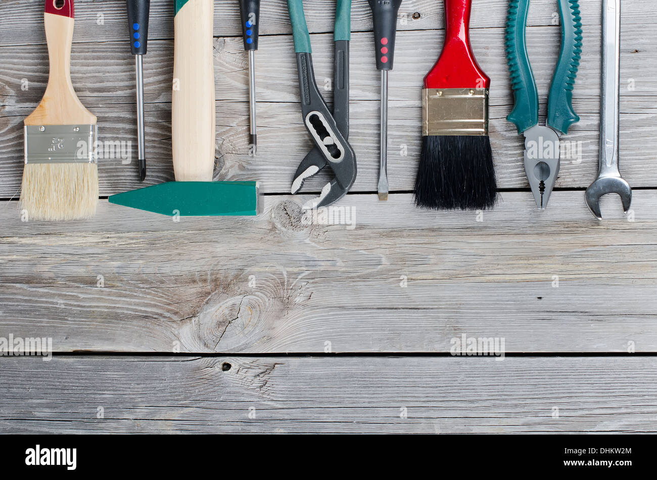 Set building tools on old boards Stock Photo - Alamy