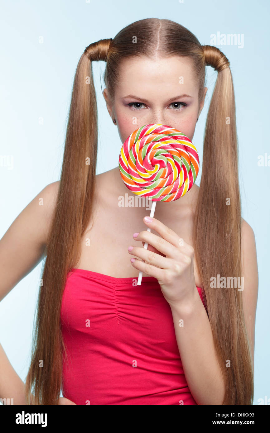 Young woman with lollipop Stock Photo - Alamy