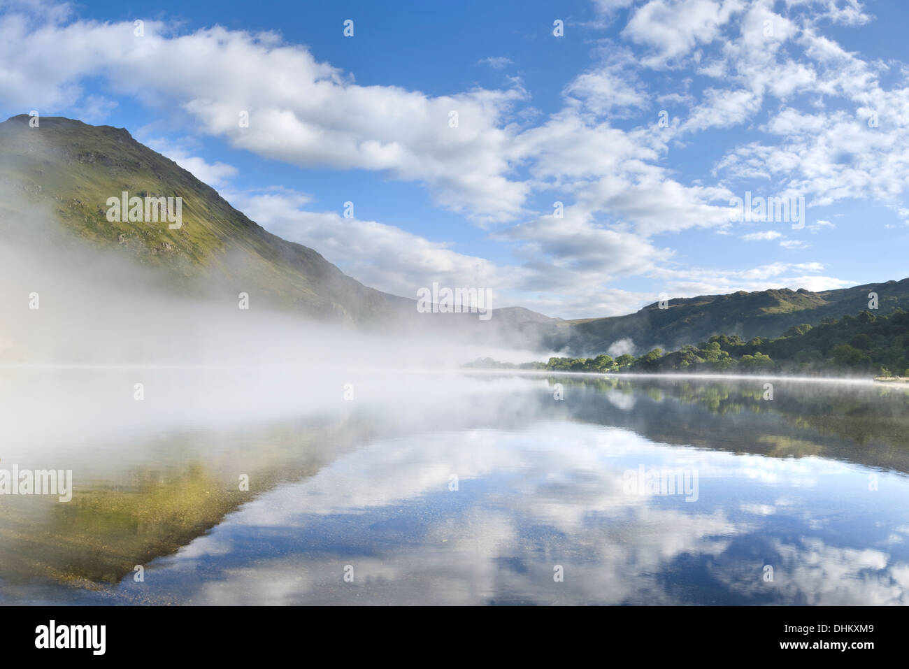 Gallt y Wenallt and clouds being reflected into Llyn Gwynant. The mist ...