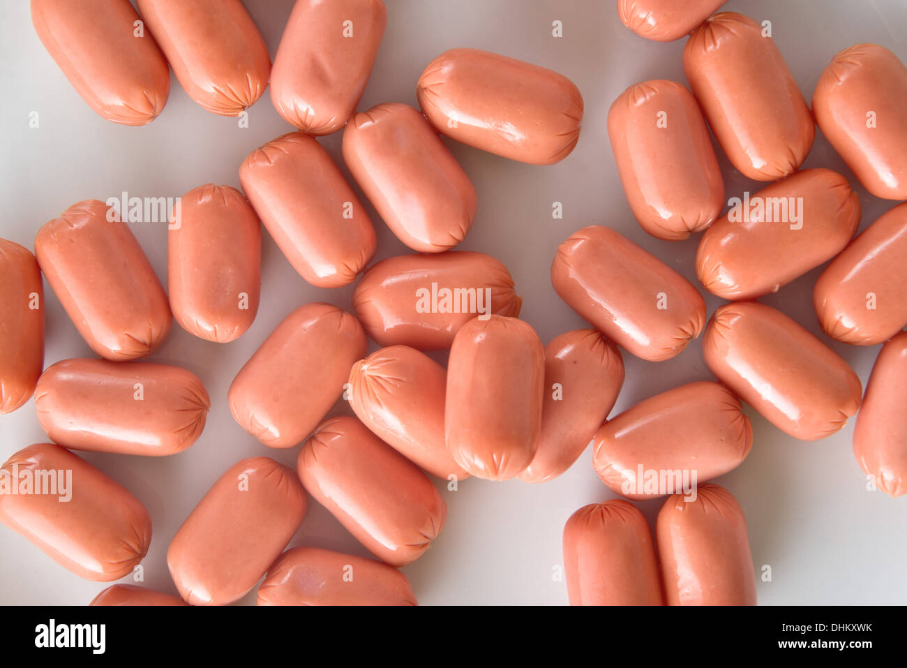Small frankfurt sausages on white plate on table Stock Photo - Alamy
