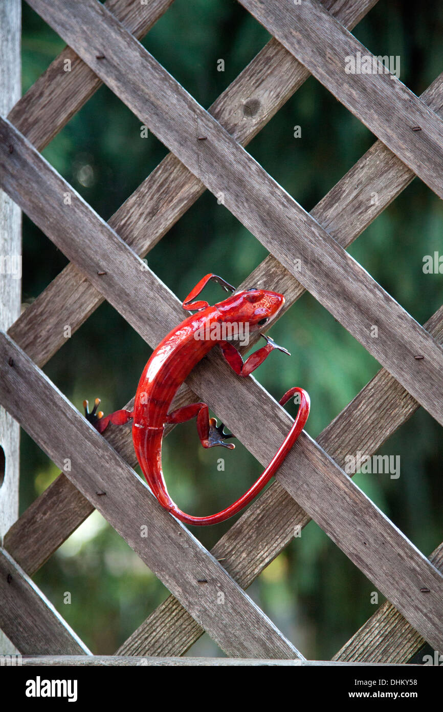 Red artistic replica of a red lizard on thatched wall. St Paul ...