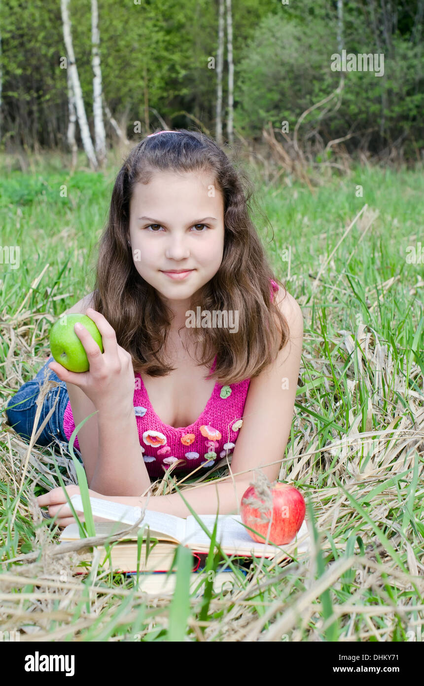 The girl with an apple Stock Photo - Alamy