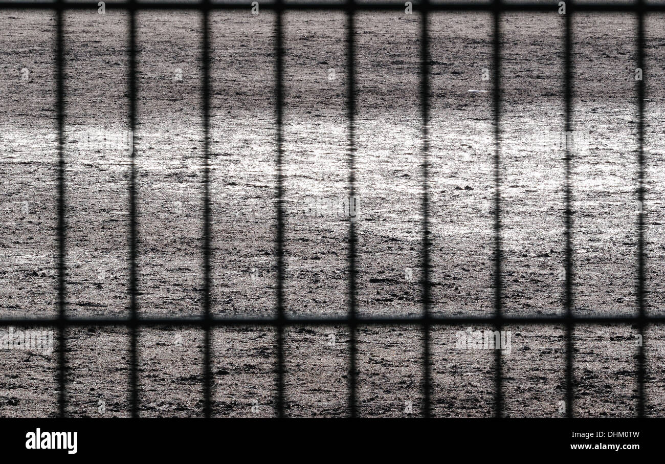 Football field behind bars Stock Photo - Alamy