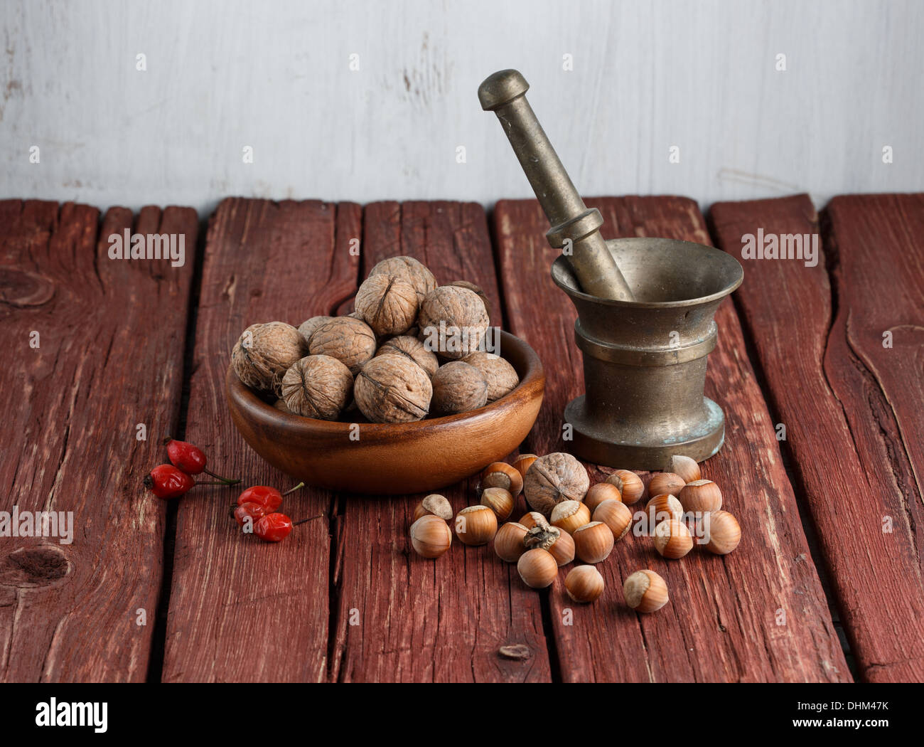 Walnuts and hazelnuts on rustic dark wood background Stock Photo - Alamy