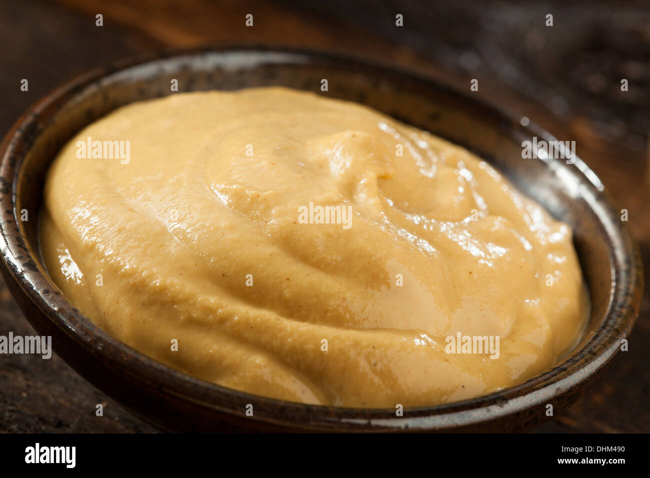 Organic Yellow Mustard Condiment in a Bowl Stock Photo - Alamy