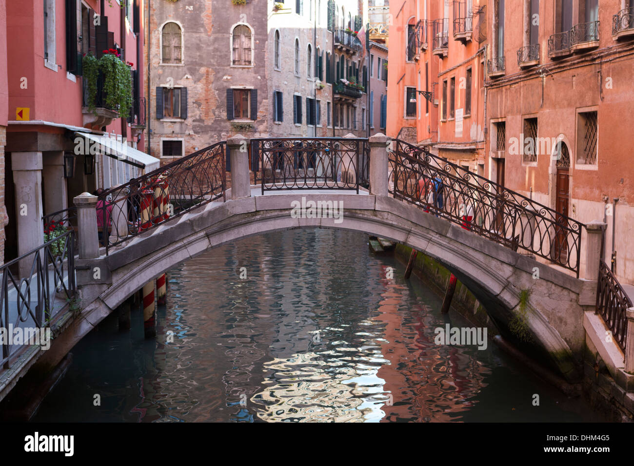 Beautiful little bridge over a small canal lined with colorful ...