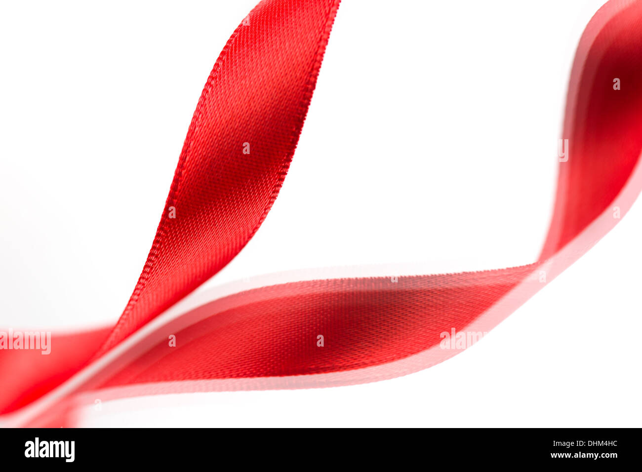 Beautiful fabric red ribbon on white background Stock Photo - Alamy
