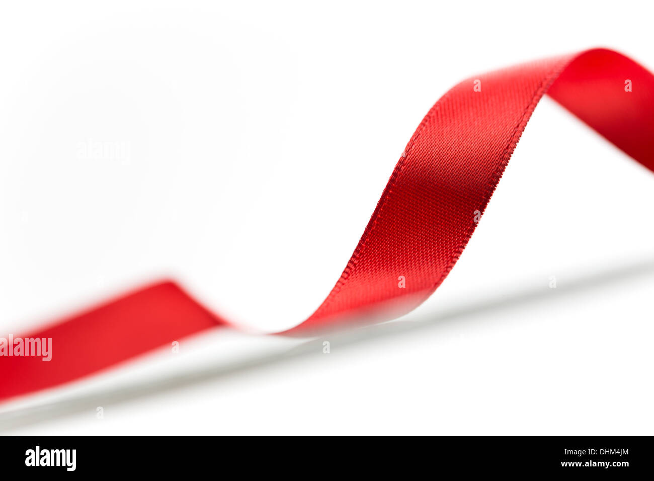 Beautiful fabric red ribbon on white background Stock Photo - Alamy