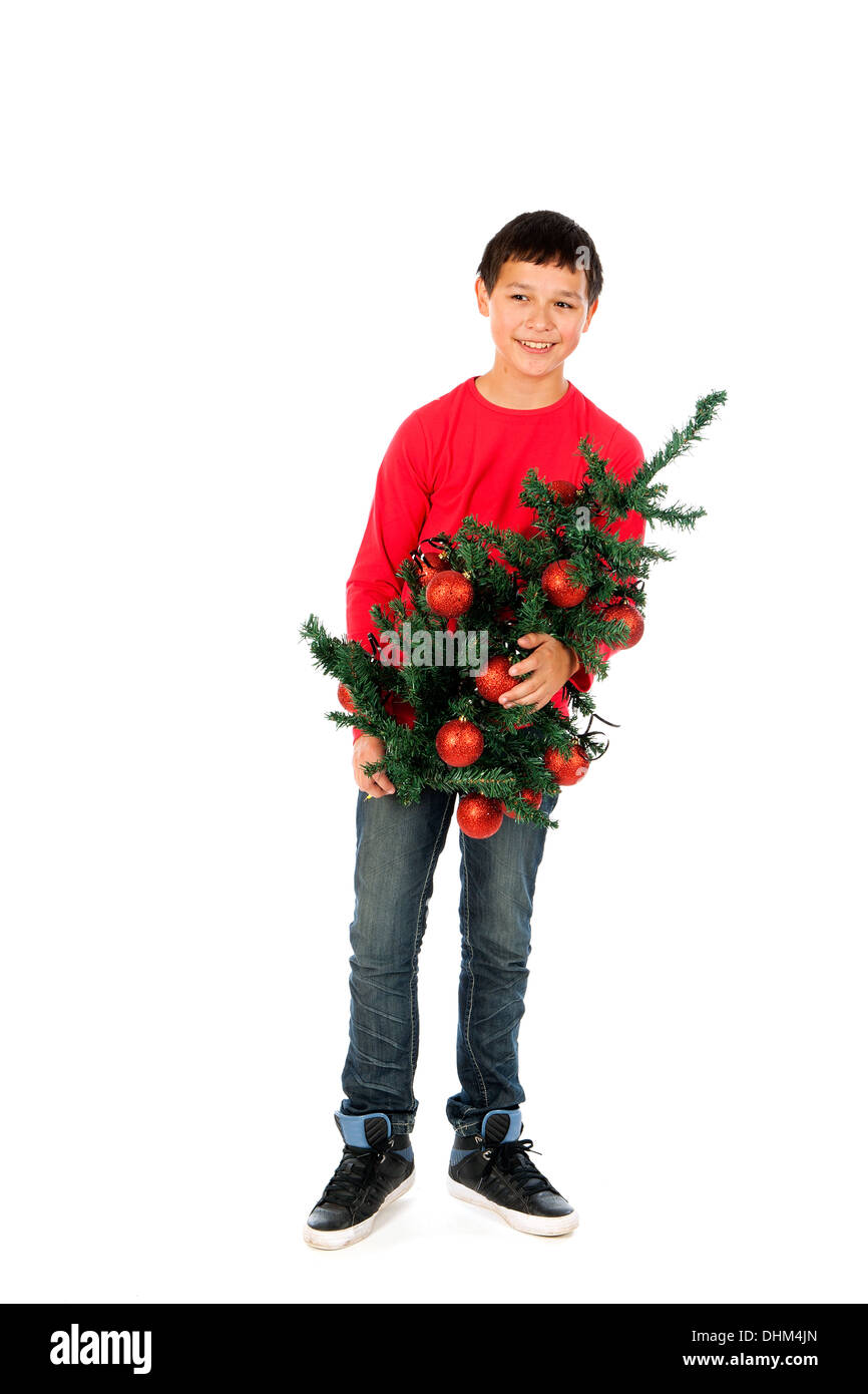 a boy with a Christmas Tree on a white background Stock Photo - Alamy