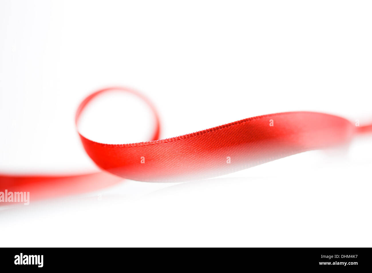 Beautiful fabric red ribbon on white background Stock Photo - Alamy