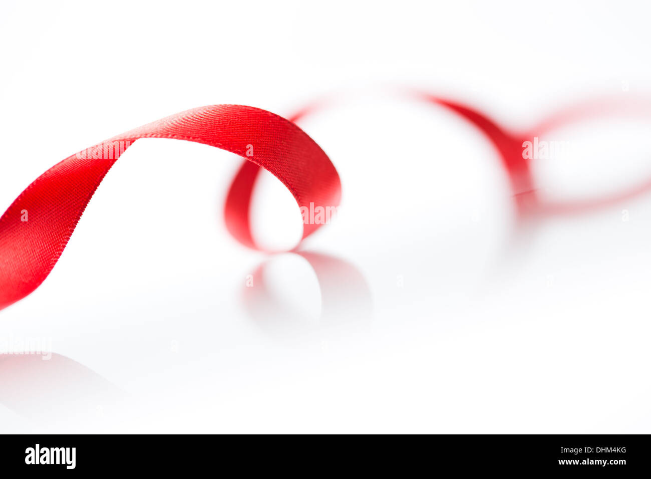 Beautiful fabric red ribbon on white background Stock Photo - Alamy