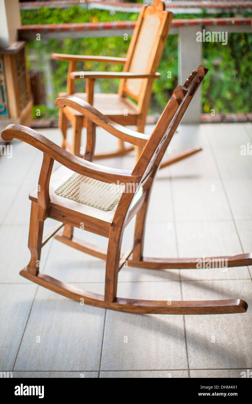 Wooden rocking chair on the terrace of an exotic hotel Stock Photo - Alamy