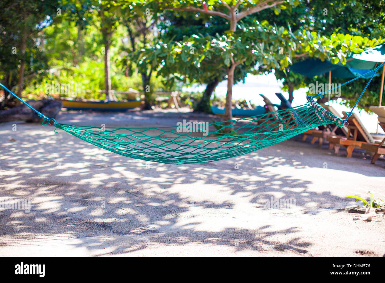 Romantic cozy hammock in the shadow of palm on tropical beach Stock ...
