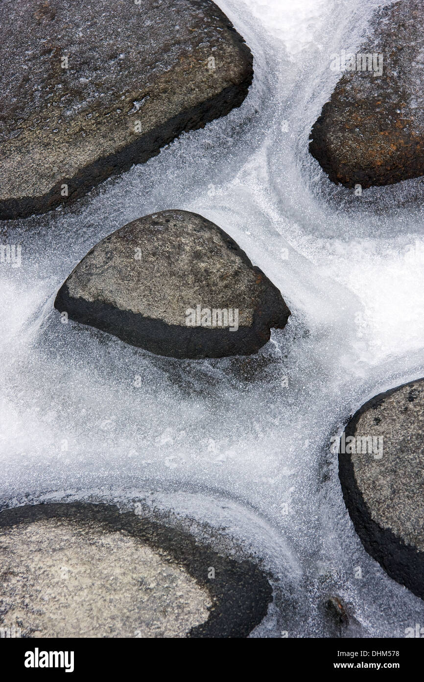 Stones in ice Stock Photo - Alamy