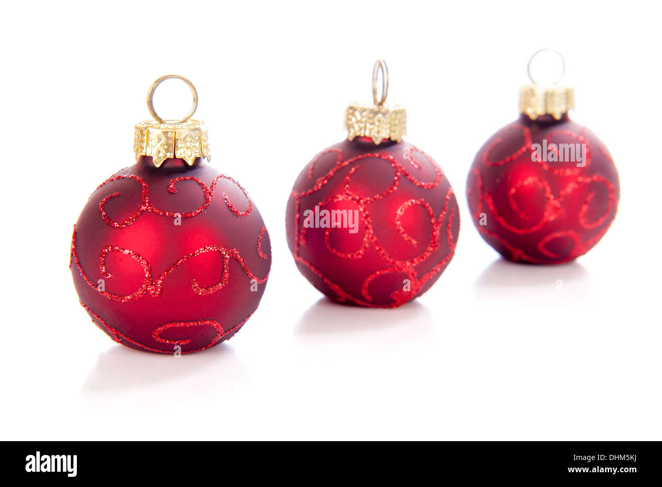 Three christmasball in a row on a white background Stock Photo - Alamy
