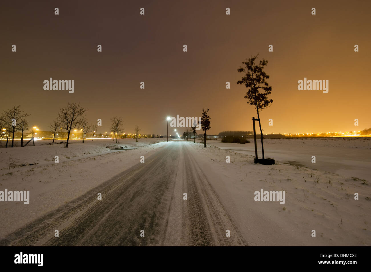 Road with snow and street lights hi-res stock photography and images ...