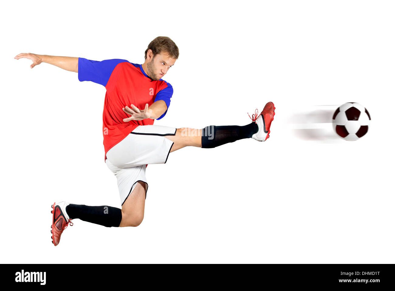 Football player kicking a ball isolated in white Stock Photo - Alamy