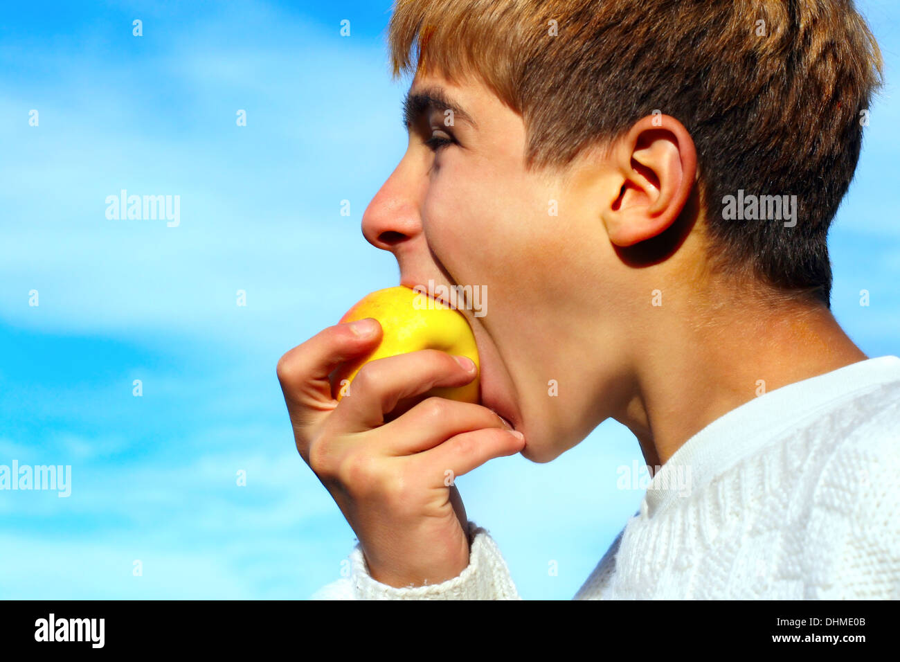 boy eat apple Stock Photo - Alamy
