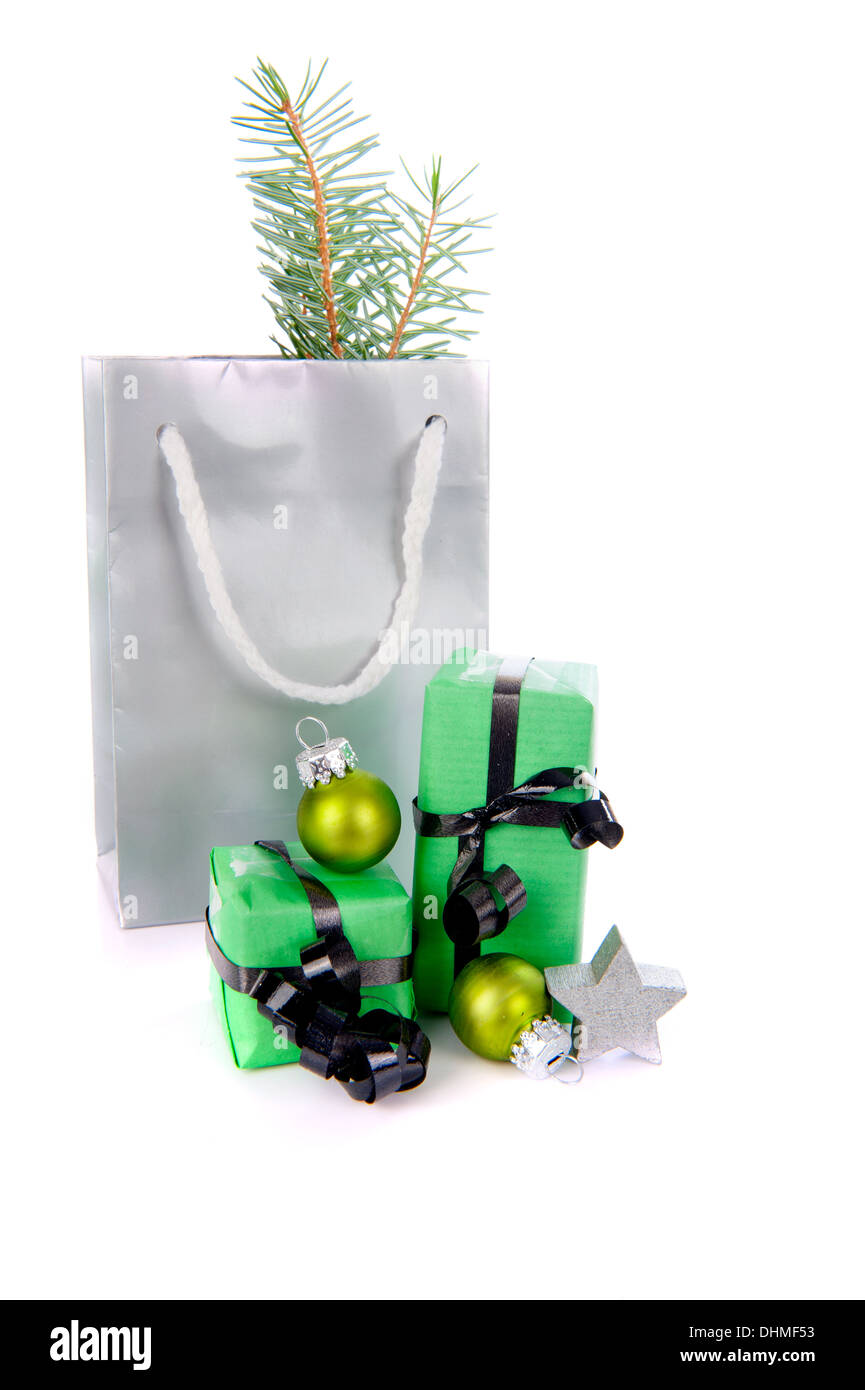 Christmas presents in green on a white background Stock Photo - Alamy