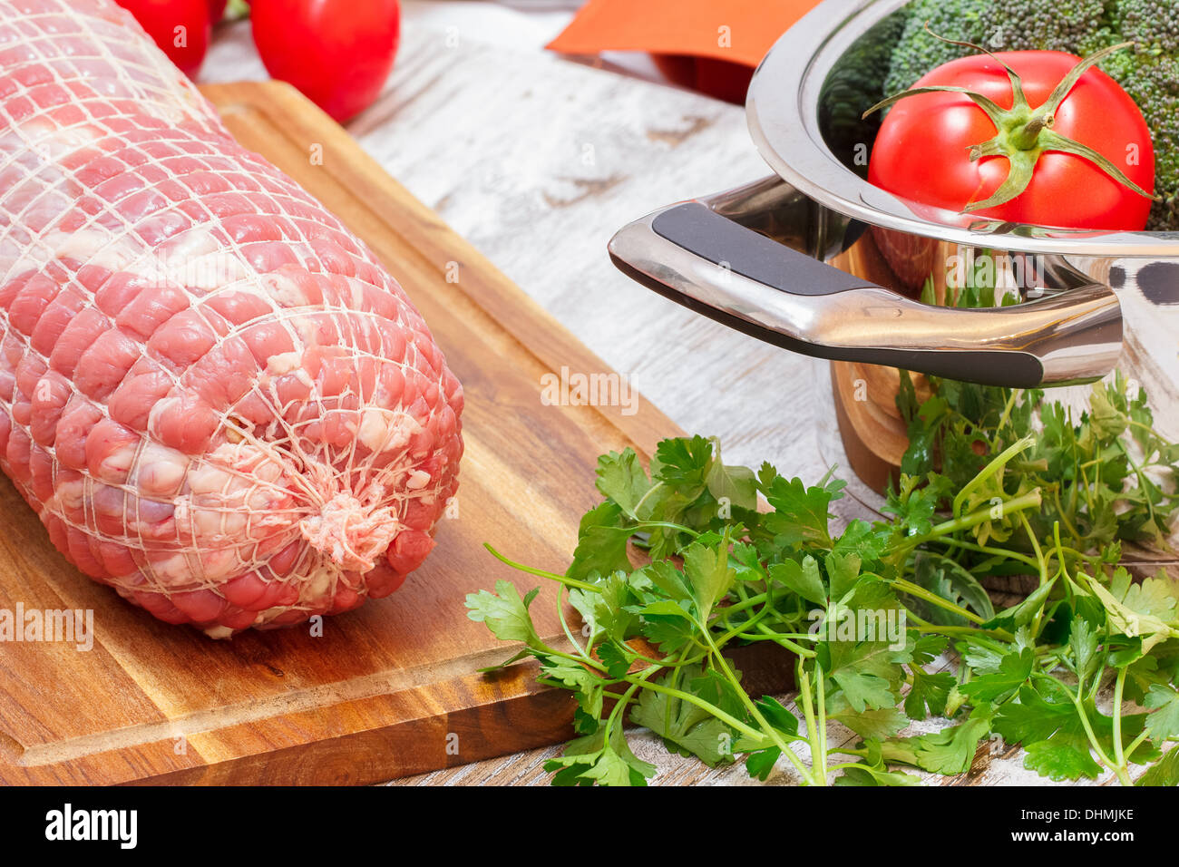 Raw veal roulade with bacon, ham , vegetables and spices Stock Photo ...