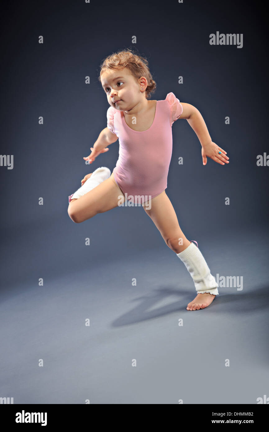 Studio shot of a little girl at fitness exercise Stock Photo - Alamy