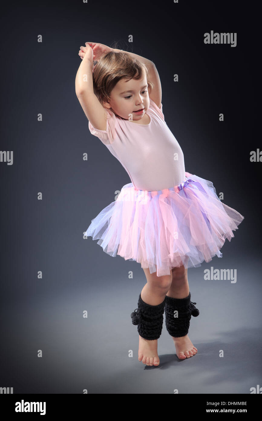 Studio shot of a little girl at dance exercise Stock Photo - Alamy
