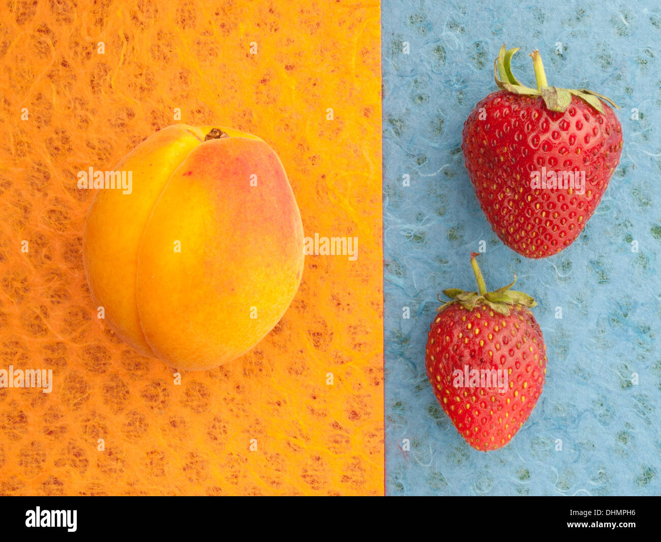 Fruit on contrasting coloured backgrounds Stock Photo - Alamy