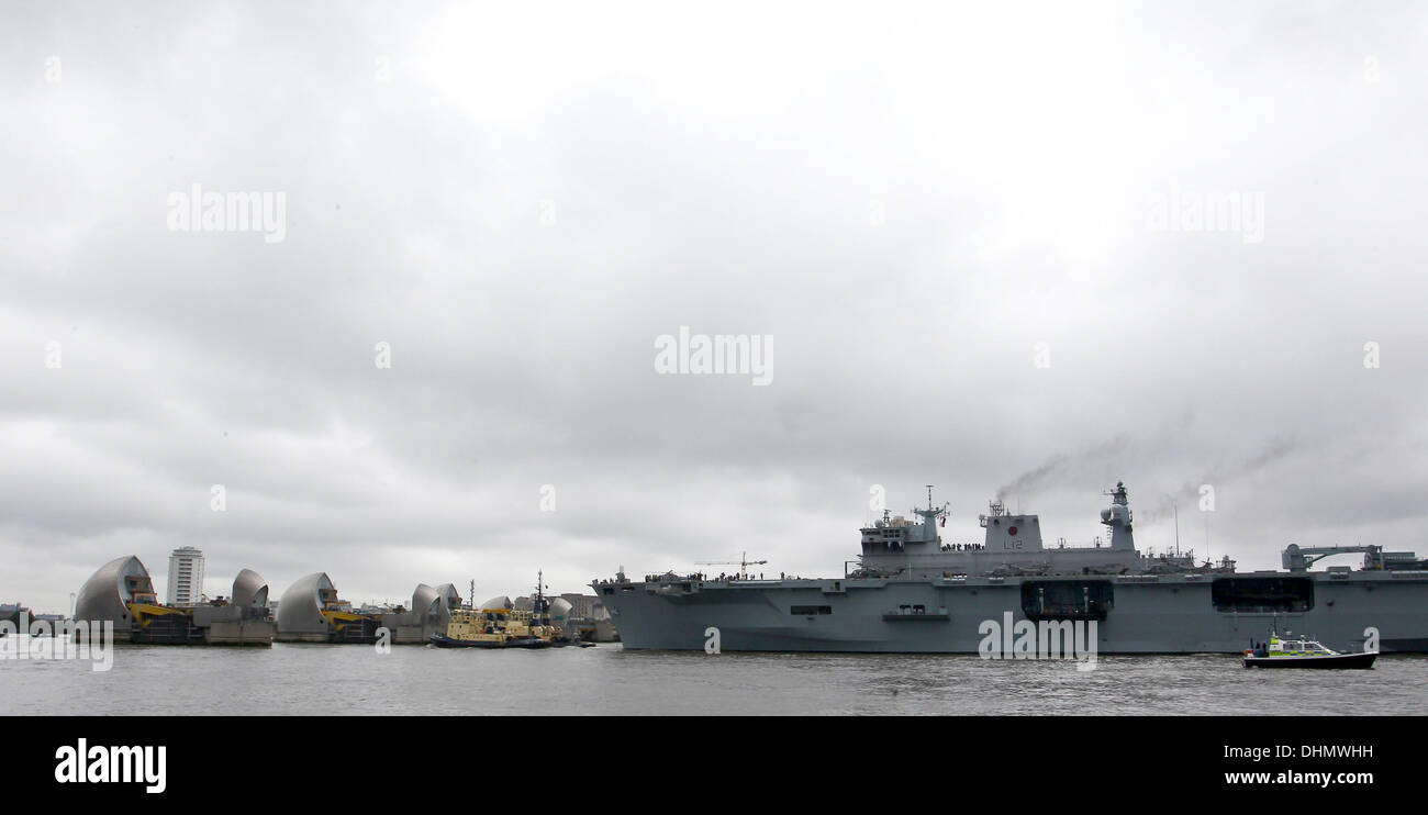 The HMS Ocean arrives in London through the Thames barrier. The ...