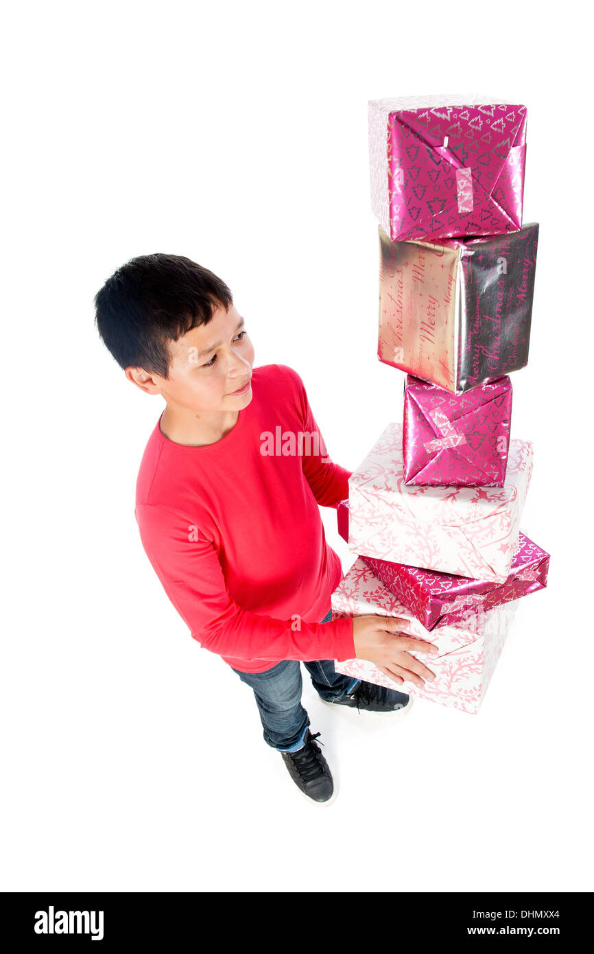 a boy, with a lot of presents on a white background Stock Photo - Alamy