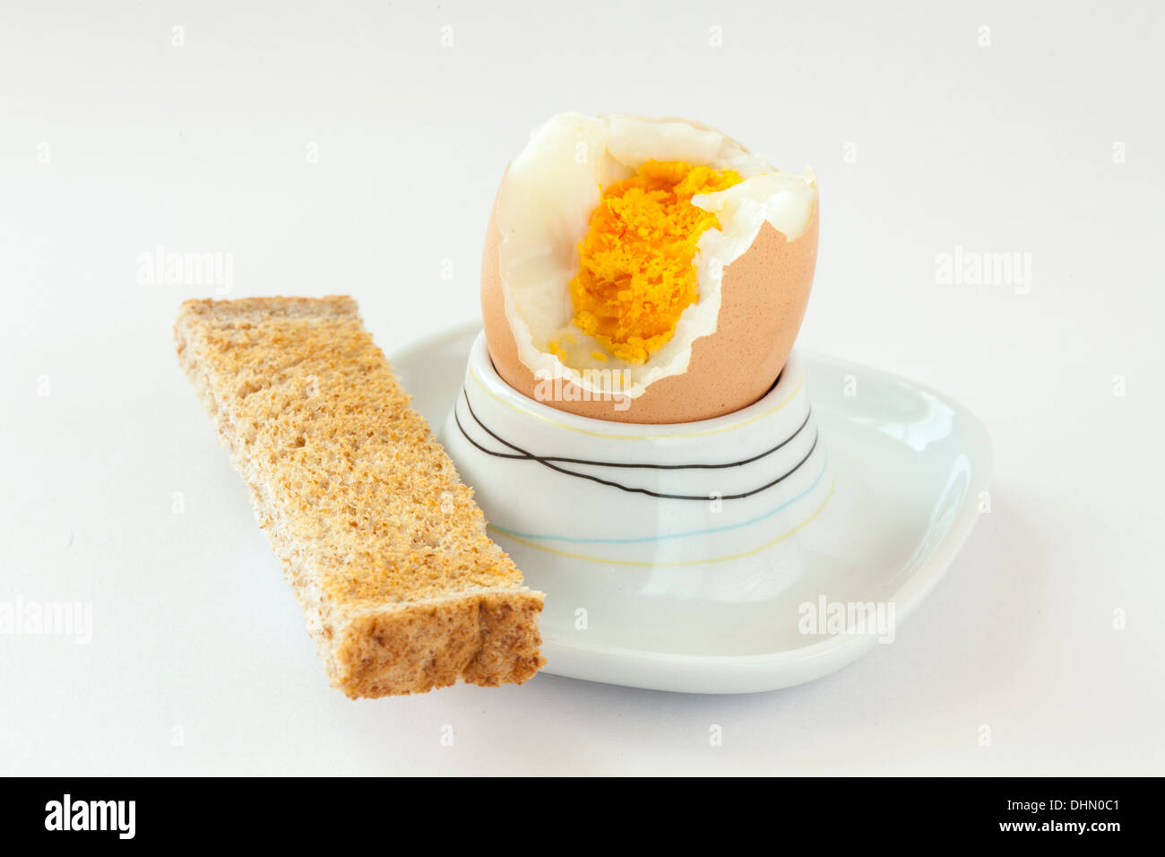 Hard Boiled Egg in holder with a Slice of toast Stock Photo - Alamy
