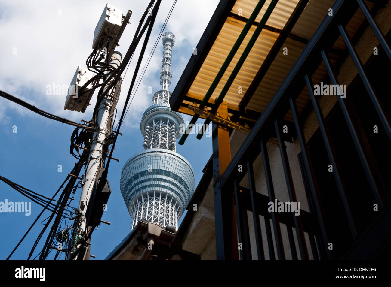 Tokyo Skytree communication tower in Oshiage, towers over small houses ...