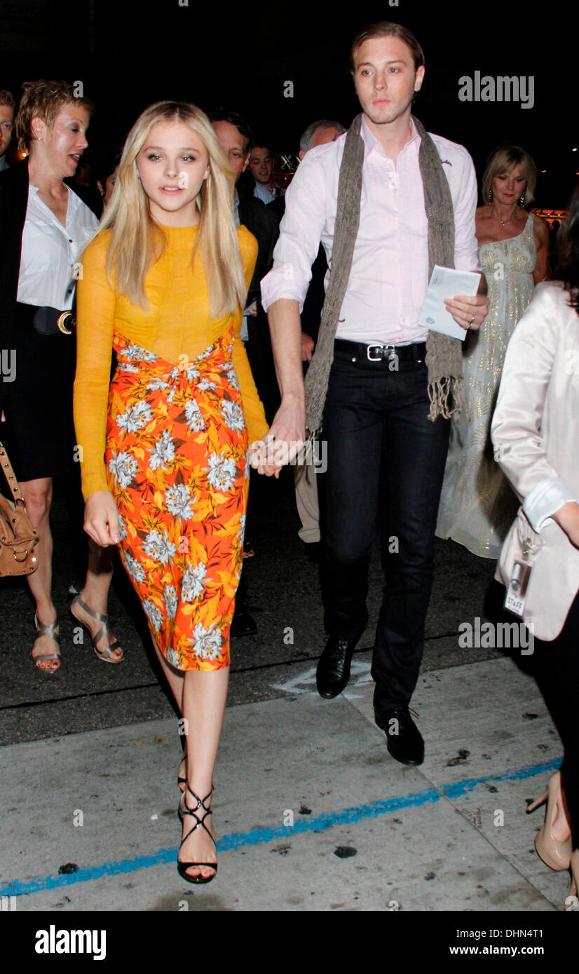 Chloe Moretz and her brother Trevor Moretz hold hands as they attend ...