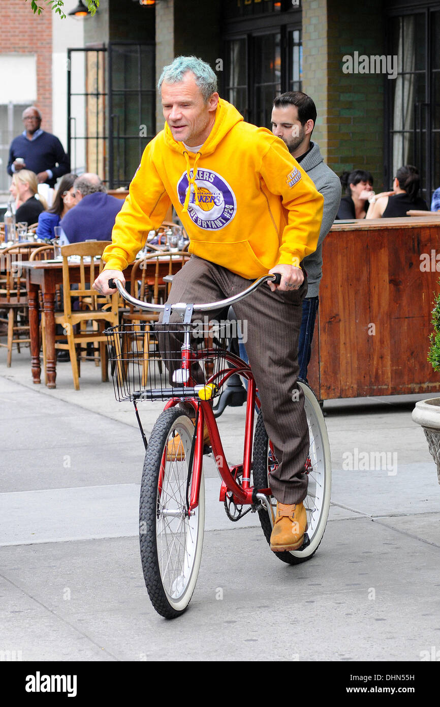 Flea aka Michael Balzary riding his bicycle in Manhattan New York City ...