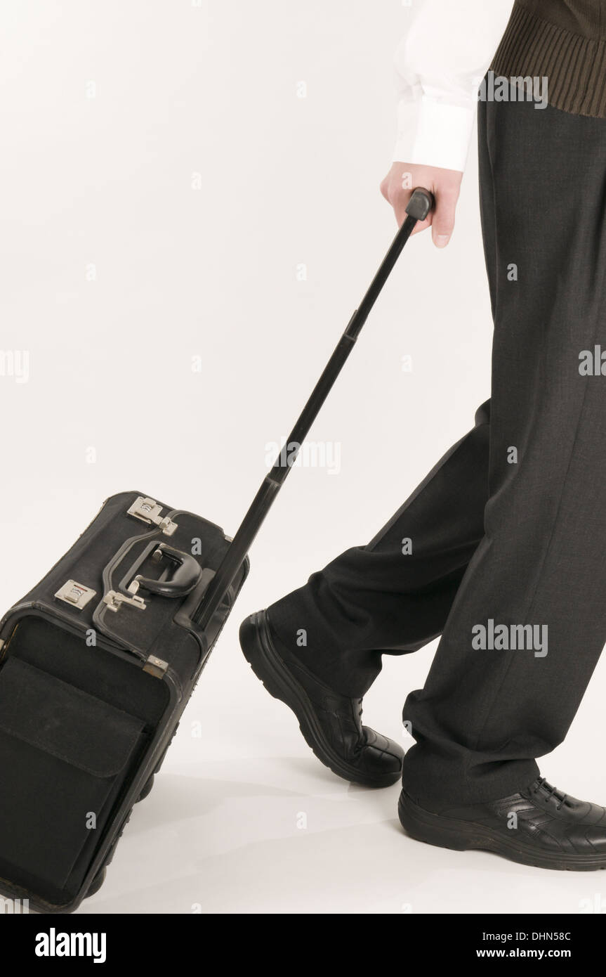 walking with suitcase vertical Stock Photo - Alamy