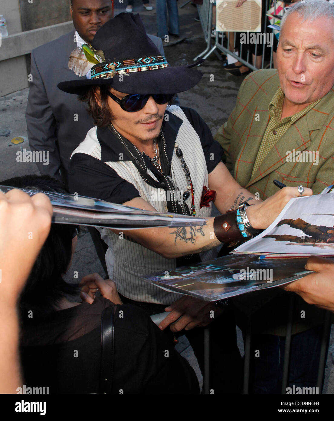 Johnny Depp signs autographs outside the El Capitan Theatre after ...