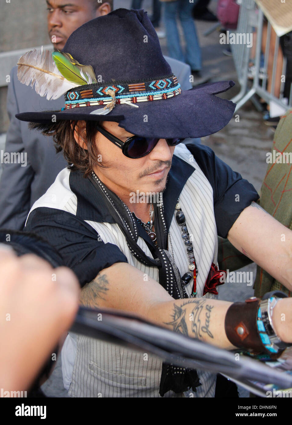 Johnny Depp signs autographs outside the El Capitan Theatre after ...
