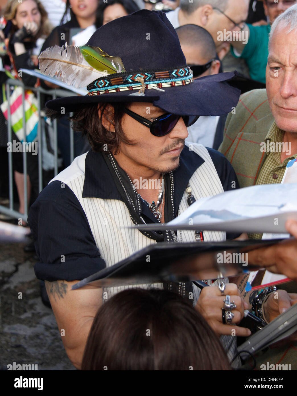 Johnny Depp signs autographs outside the El Capitan Theatre after ...