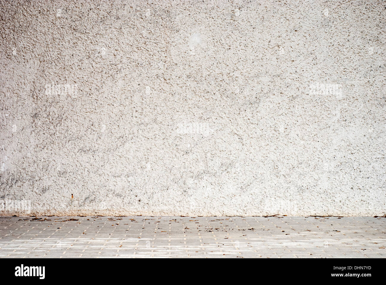 stucco white wall, floor tiles, maple seeds on the ground Stock Photo ...