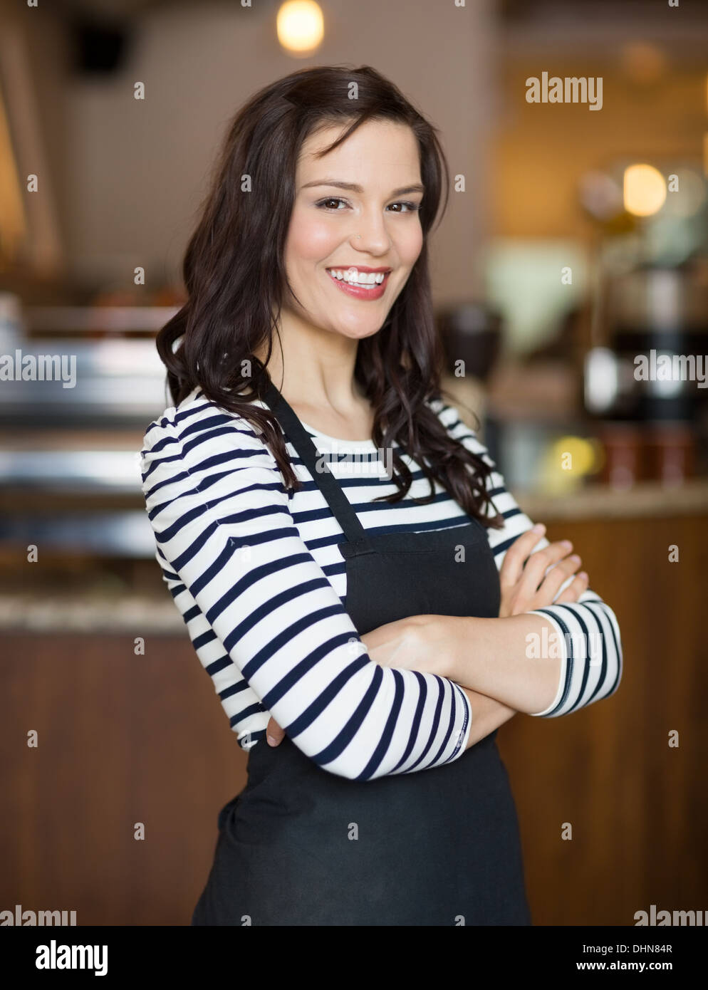 Happy Waitress Standing In Cafe Stock Photo - Alamy