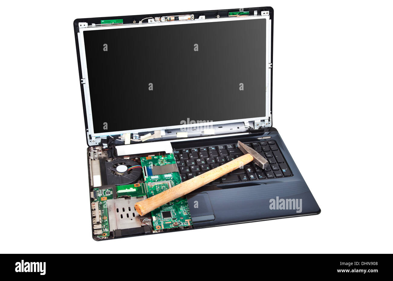Laptop half disassembled with hummer on it Stock Photo - Alamy