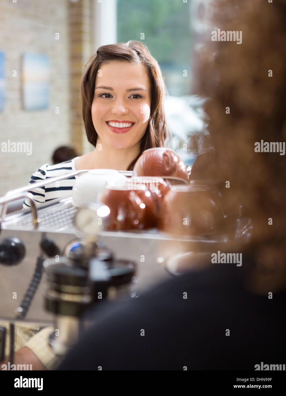 Customer Looking At Waitress In Cafeteria Stock Photo - Alamy