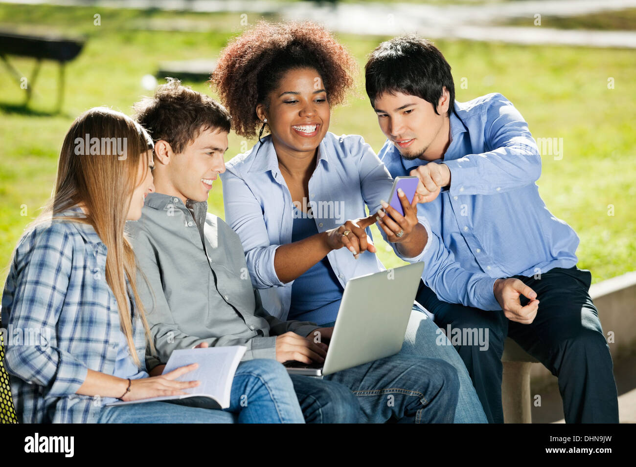 Students With Using Mobilephone In University Campus Stock Photo - Alamy