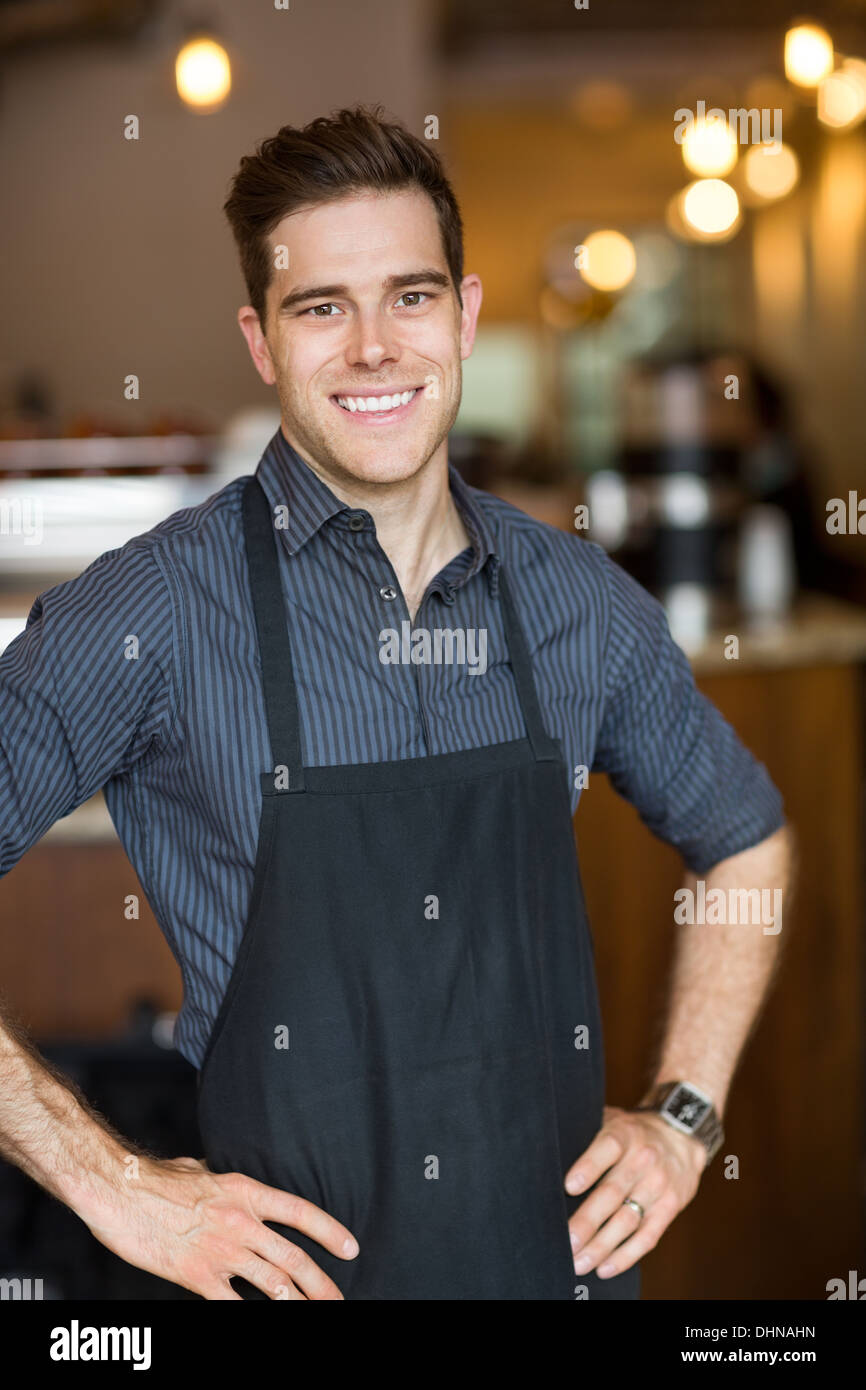 Happy Male Owner Standing In Cafe Stock Photo - Alamy