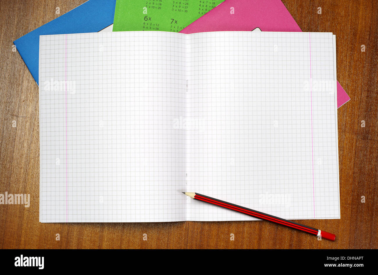 Opened school notebook and pencil on table Stock Photo - Alamy