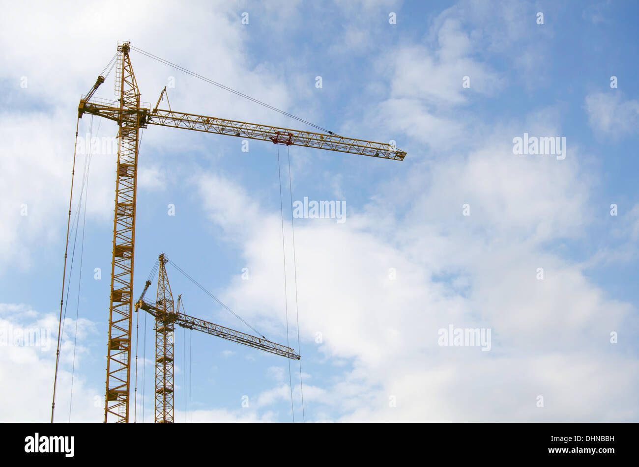 Elevating crane against the cloudy sky Stock Photo - Alamy