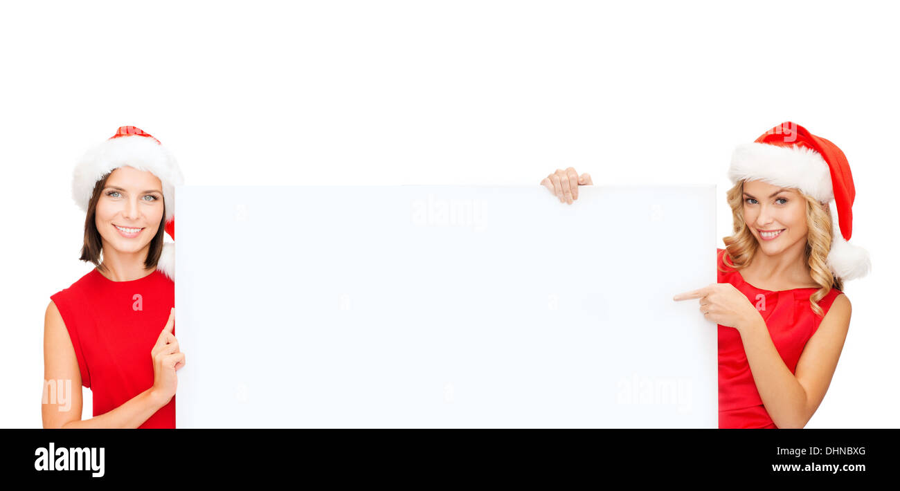 women in santa helper hat with blank white board Stock Photo - Alamy