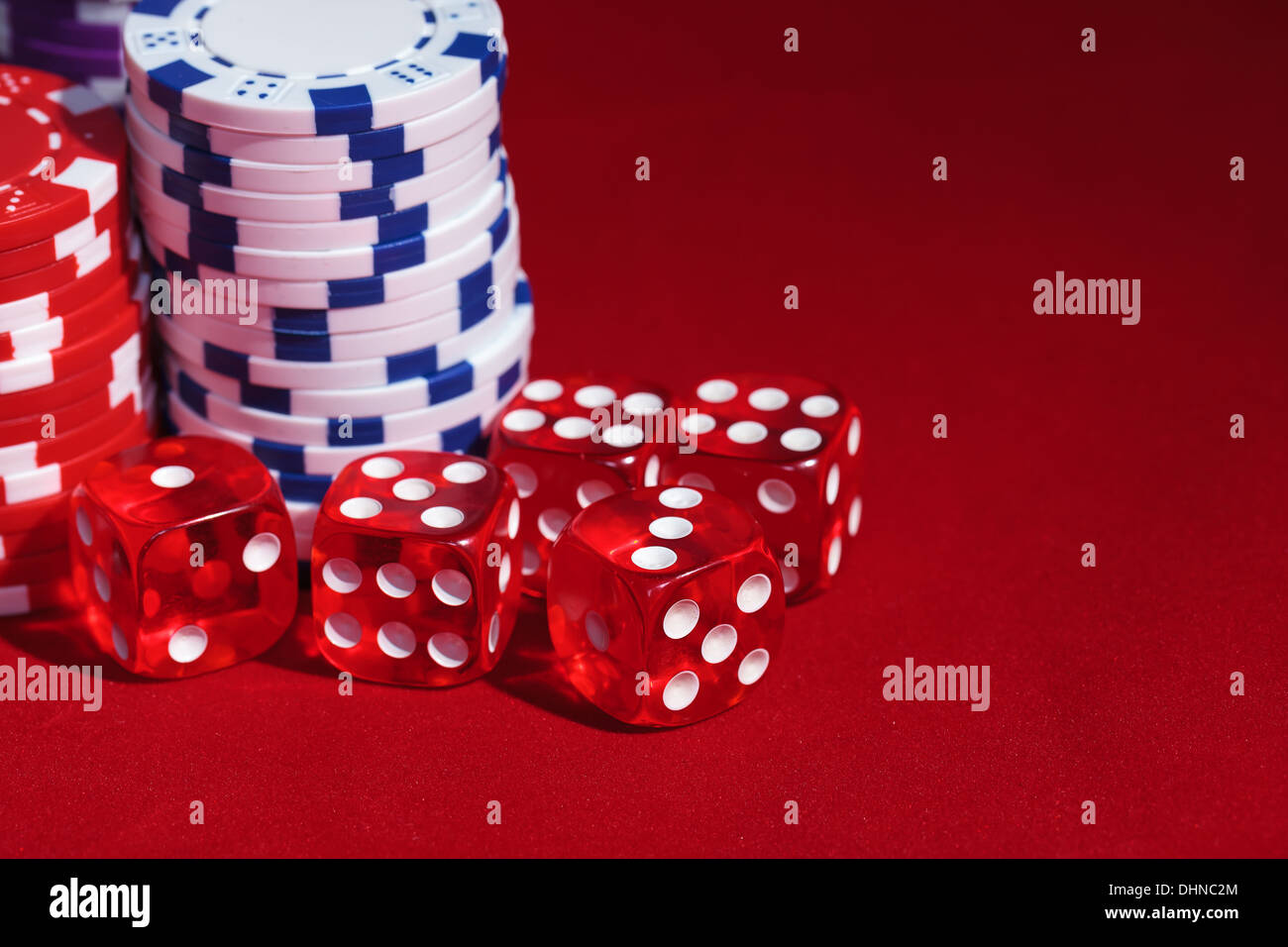 Stacks of Poker Chips with Playing Bones Stock Photo - Alamy