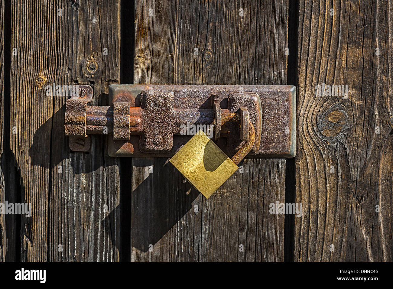 Old key lock on wooden door Stock Photo - Alamy